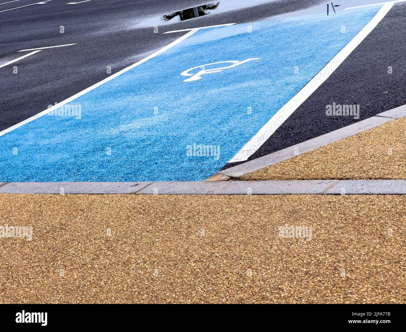 Disabled parking space in an empty outdoor parking lot Stock Photo - Alamy