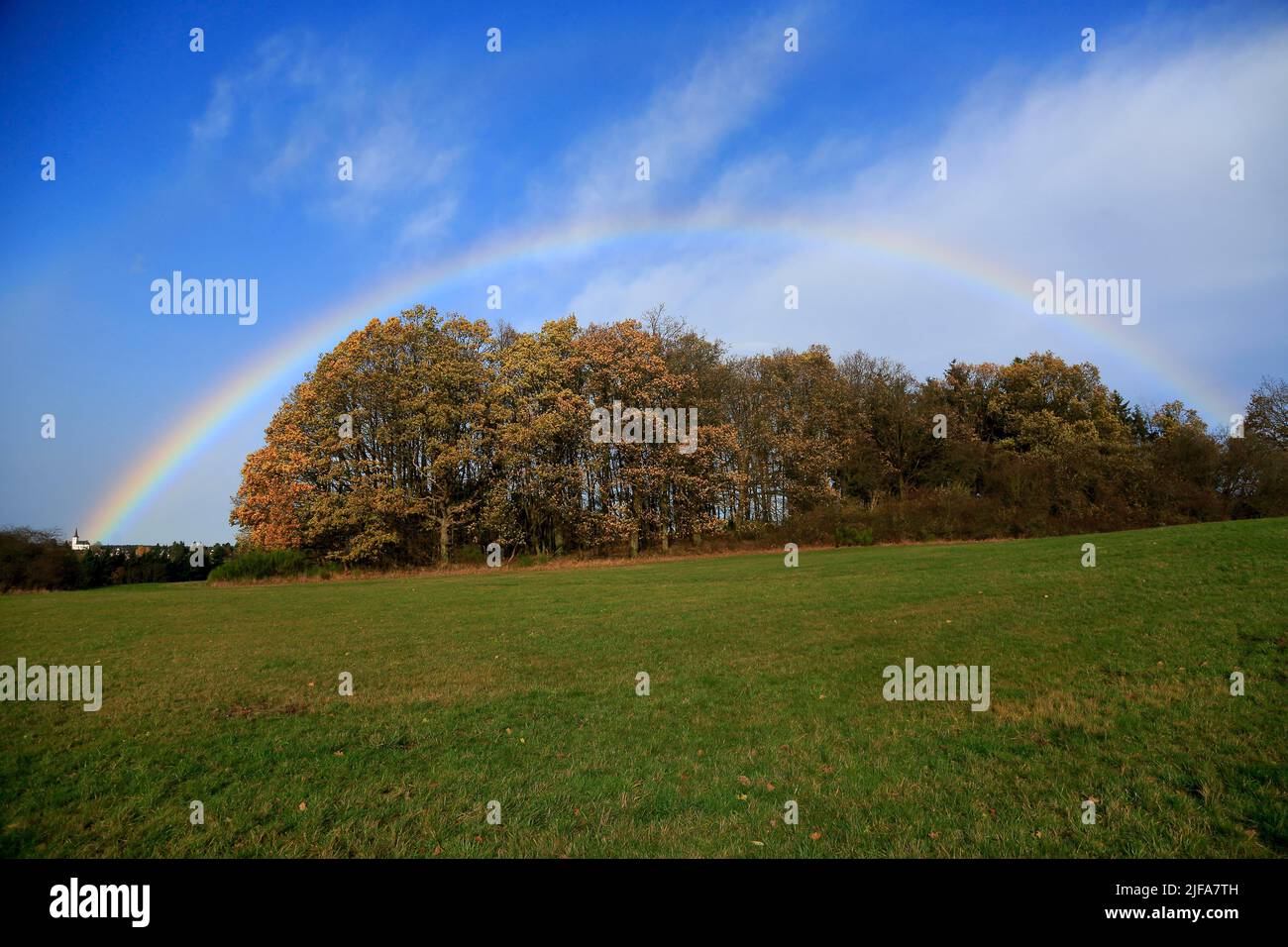 Rainbow over field and woodland near Eschweiler, Bad Muenstereifel ...