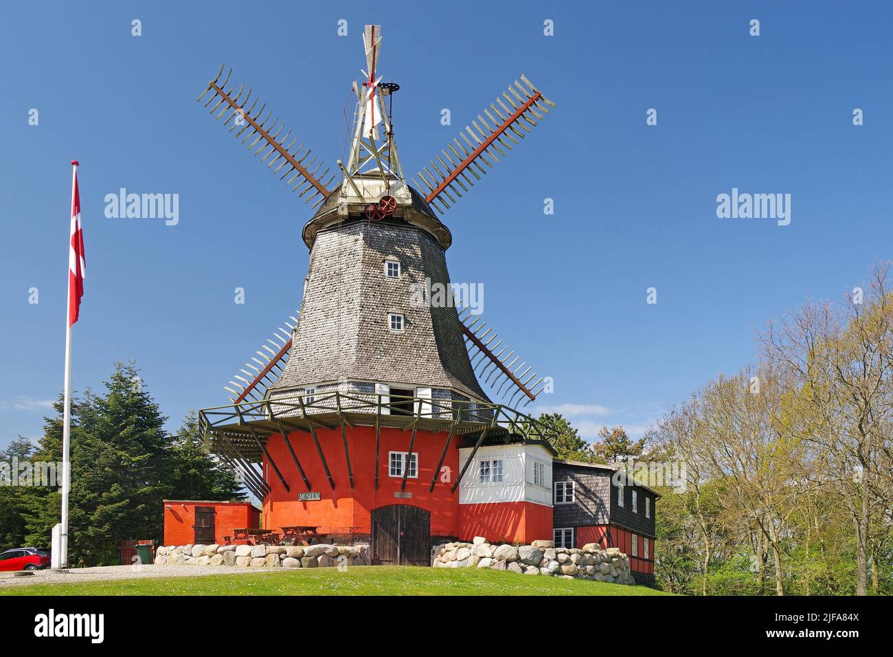Large windmill with Danish flag, red, May, Traneker Slotsmolle, Langeland, Denmark Stock Photo ...