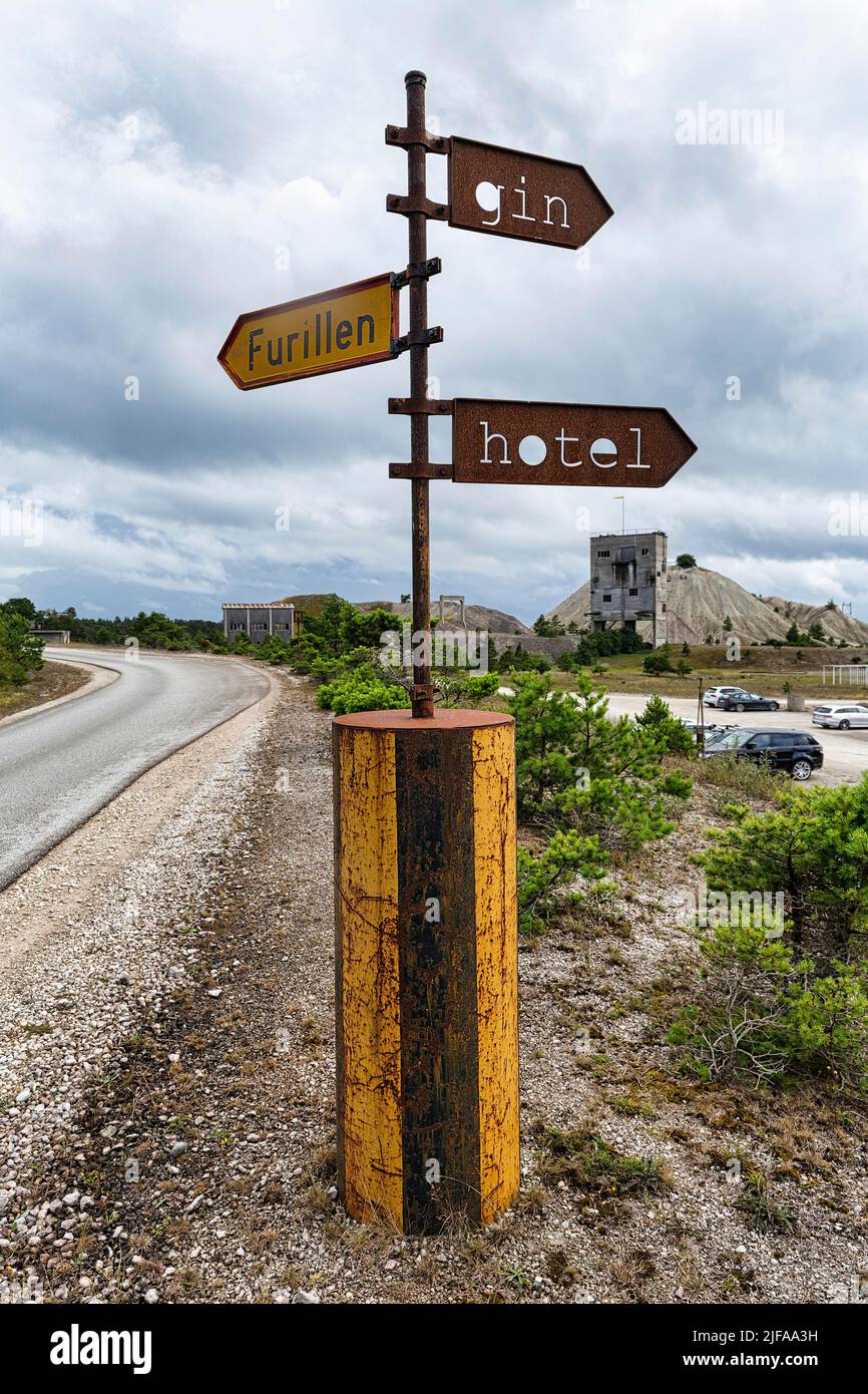 Rusty iron signs, signposts with inscription Furillen, gin, hotel ...