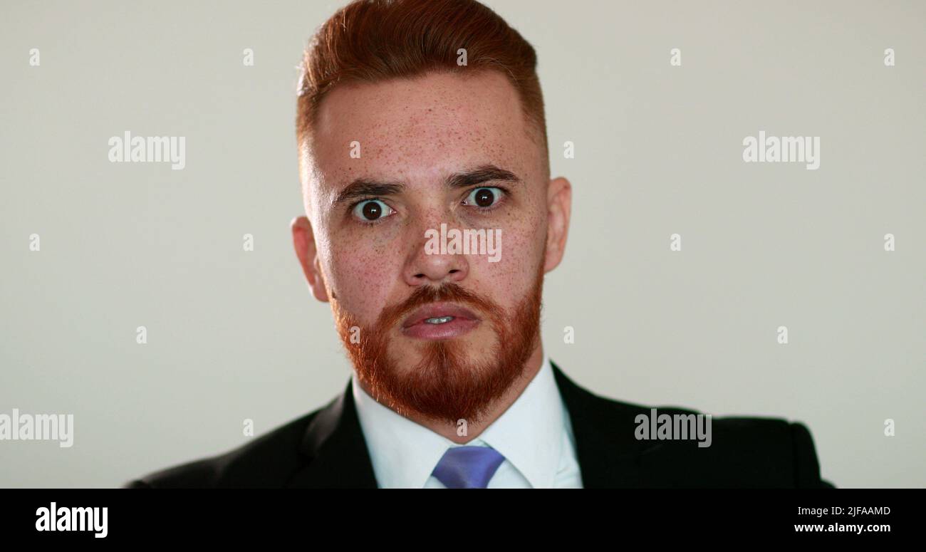 Business man shock reaction. handsome man wearing suit reacting with ...