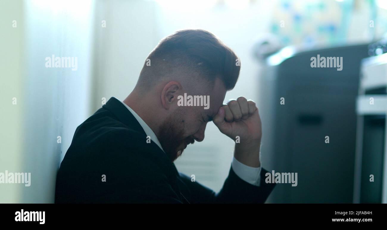 Business sitting floor feeling despair and frustration. Entrepreneur ...