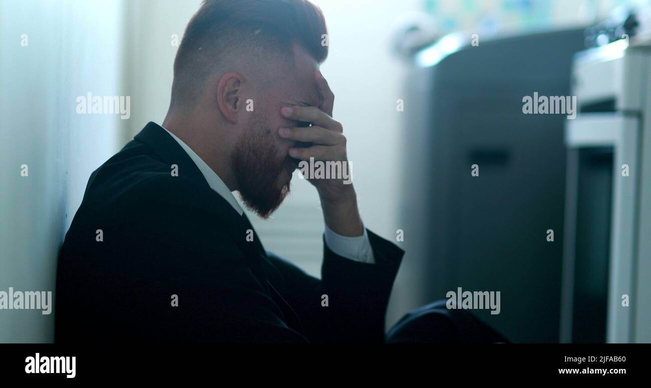 Business sitting floor feeling despair and frustration. Entrepreneur ...