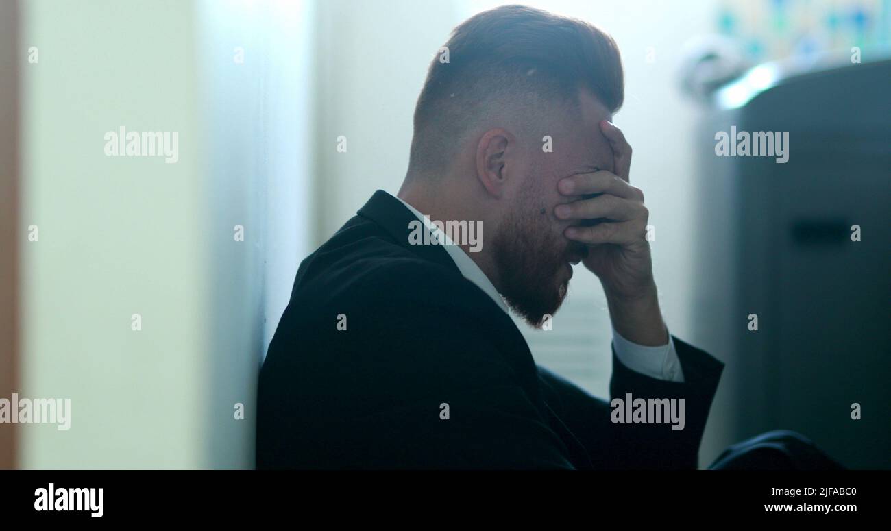 Business sitting floor feeling despair and frustration. Entrepreneur ...