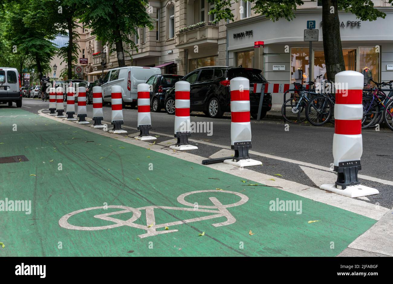 Bicycle lane with green marking and safety bollards, Fasanenstrasse ...