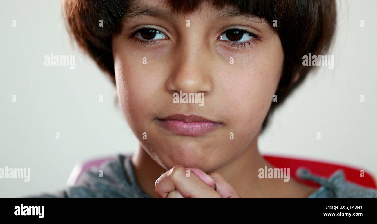 Child boy giving pray, kid portrait face praying with hands in gesture ...