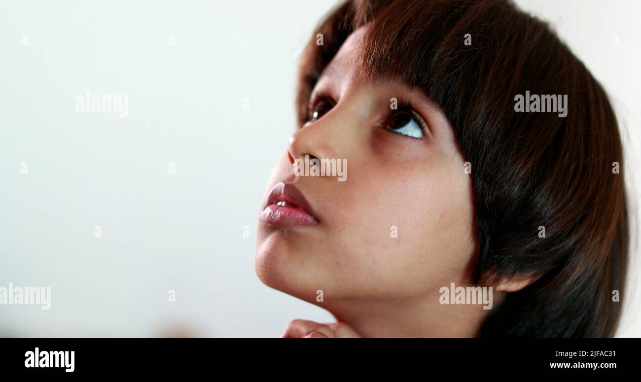 Child praying to God, spiritual child with hands held together, faitful ...