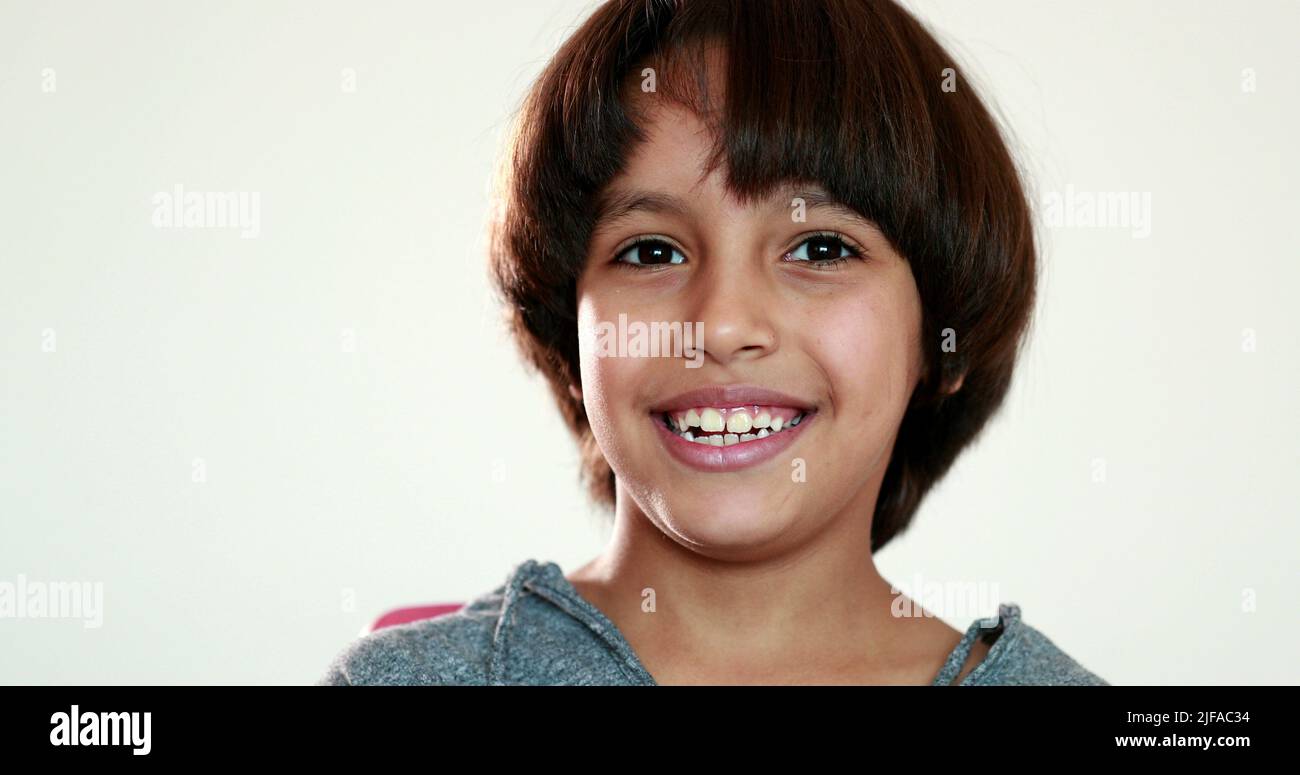 Child winking to camera, mixed race kid winks Stock Photo - Alamy