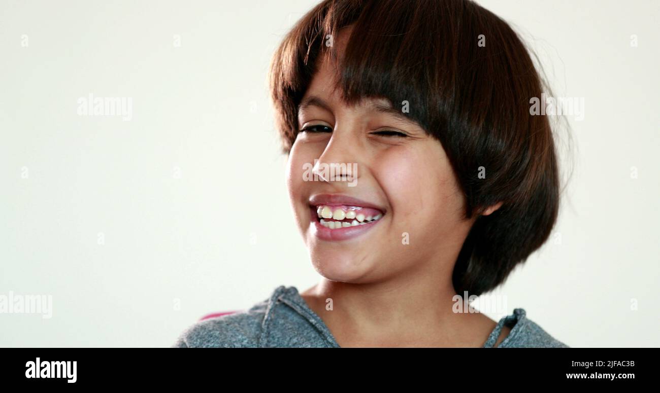Child winking to camera, mixed race kid winks Stock Photo - Alamy