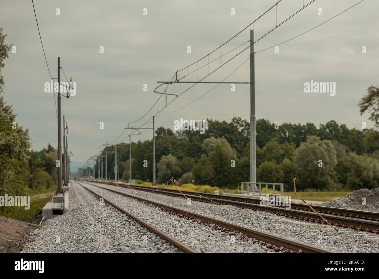 New fresh train tracks and gravel. Renovation of track, metal steel ...