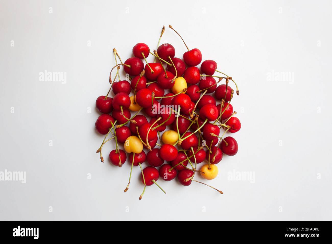 Heap of sweet cherries isolated on white background from a high angle ...