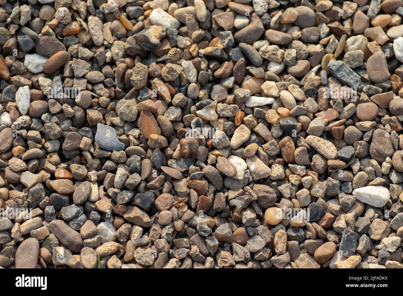 little brown pebbles on the ground cover everything Stock Photo - Alamy
