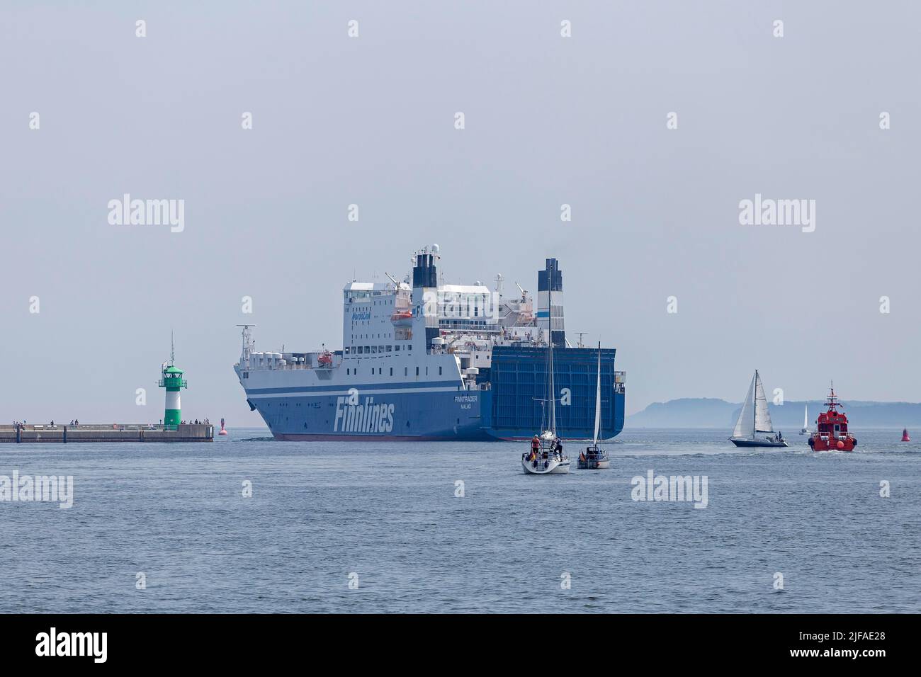 Finnlines ferry leaves, lighthouse, boats, Travemuende, Luebeck ...