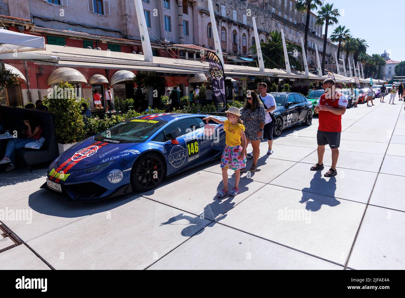 OneLife Rally cars attract the attention of passers-by along the ...