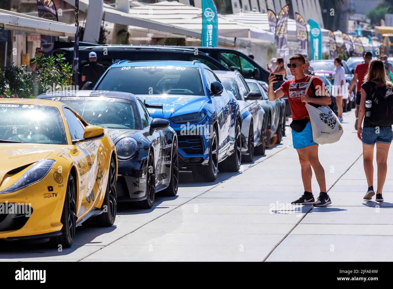 OneLife Rally cars attract the attention of passers-by along the ...