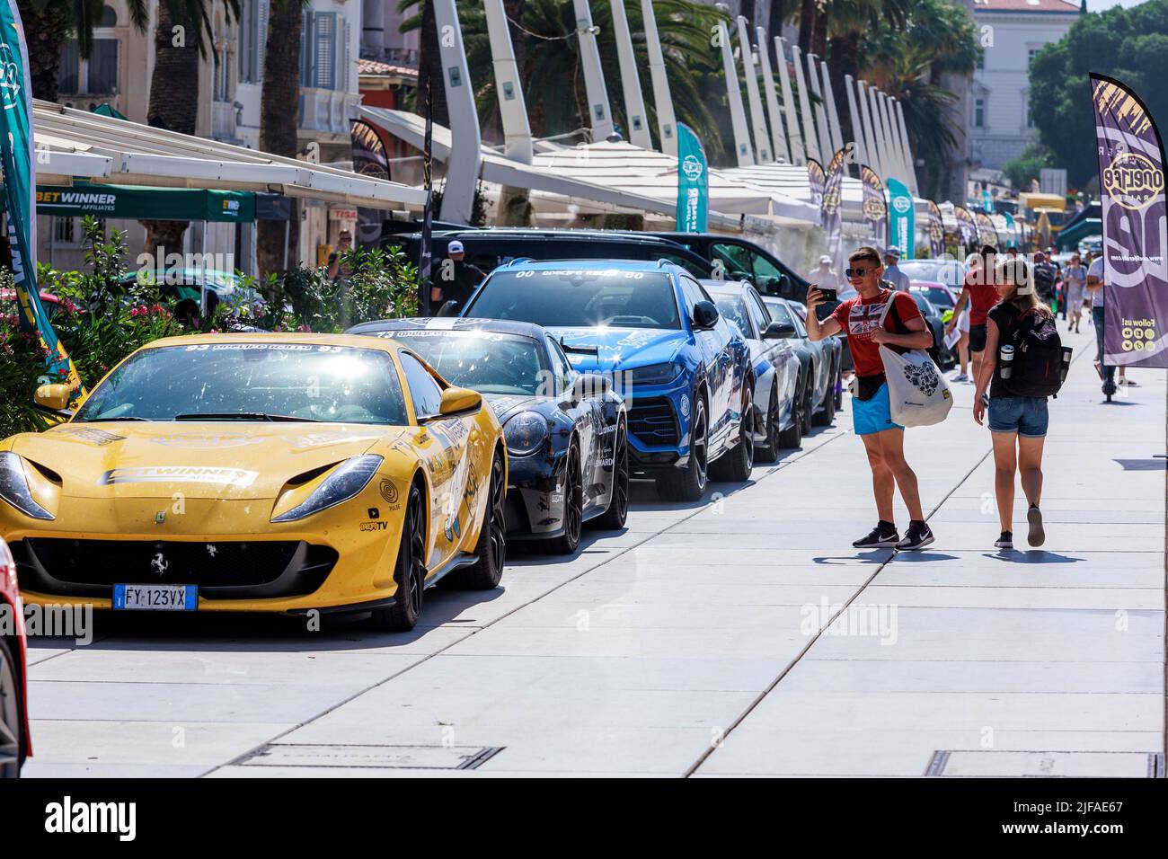 OneLife Rally cars attract the attention of passers-by along the ...