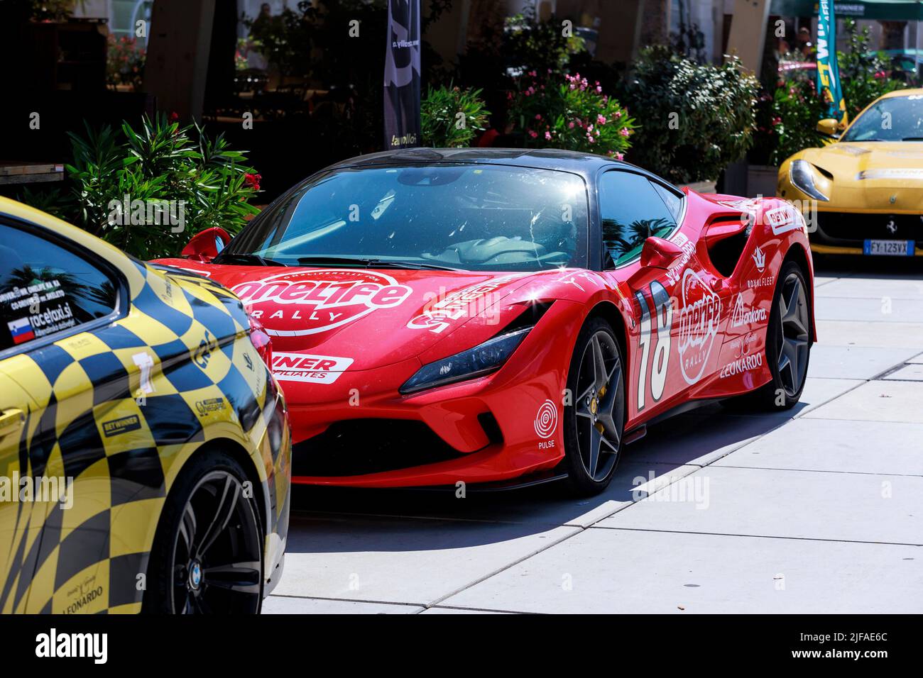 OneLife Rally cars attract the attention of passers-by along the ...