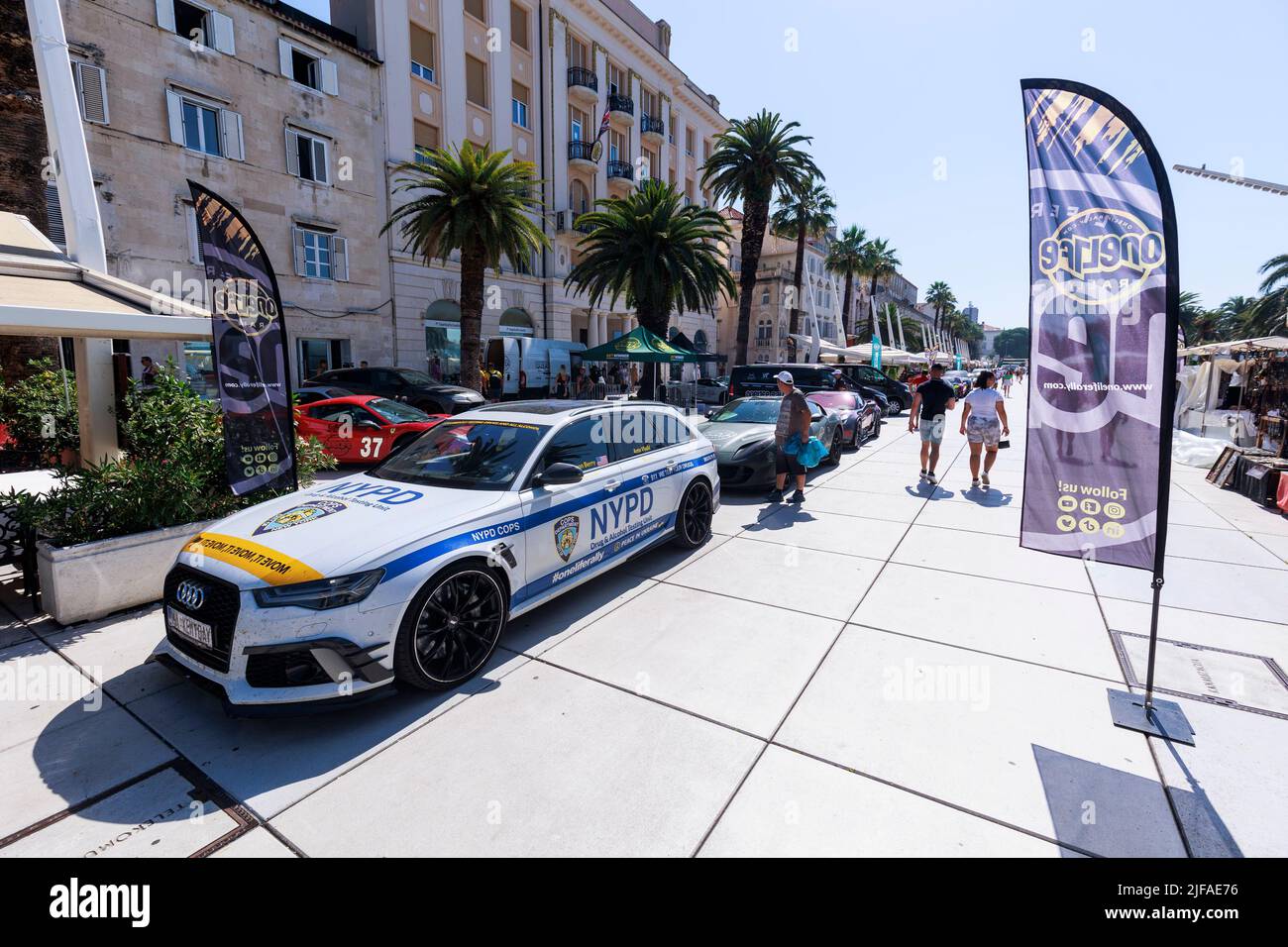 OneLife Rally cars attract the attention of passers-by along the ...