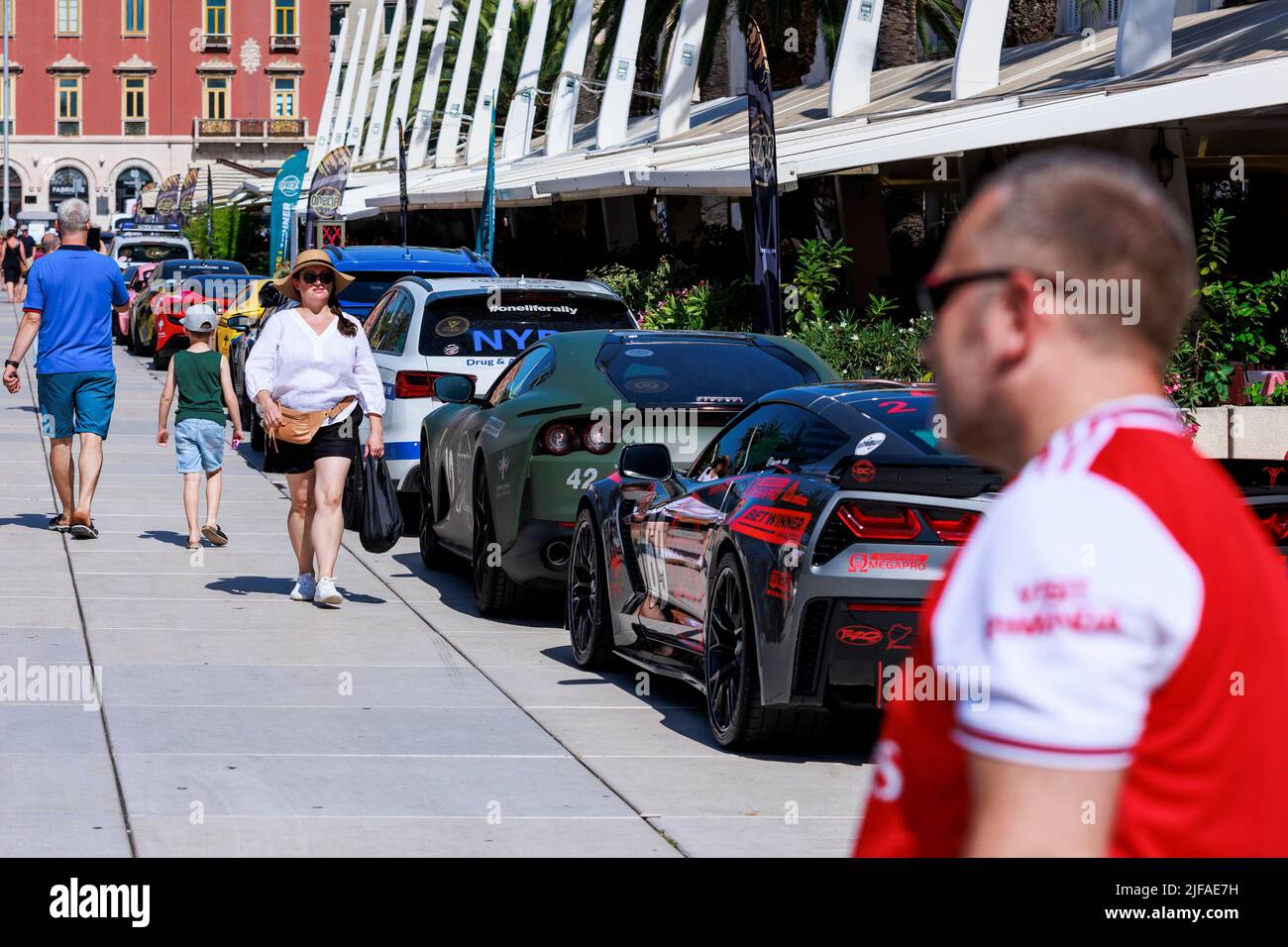 OneLife Rally cars attract the attention of passers-by along the ...