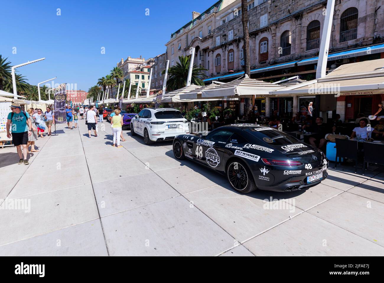 OneLife Rally cars attract the attention of passers-by along the ...