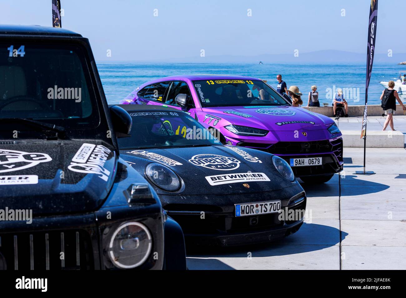 OneLife Rally cars attract the attention of passers-by along the ...