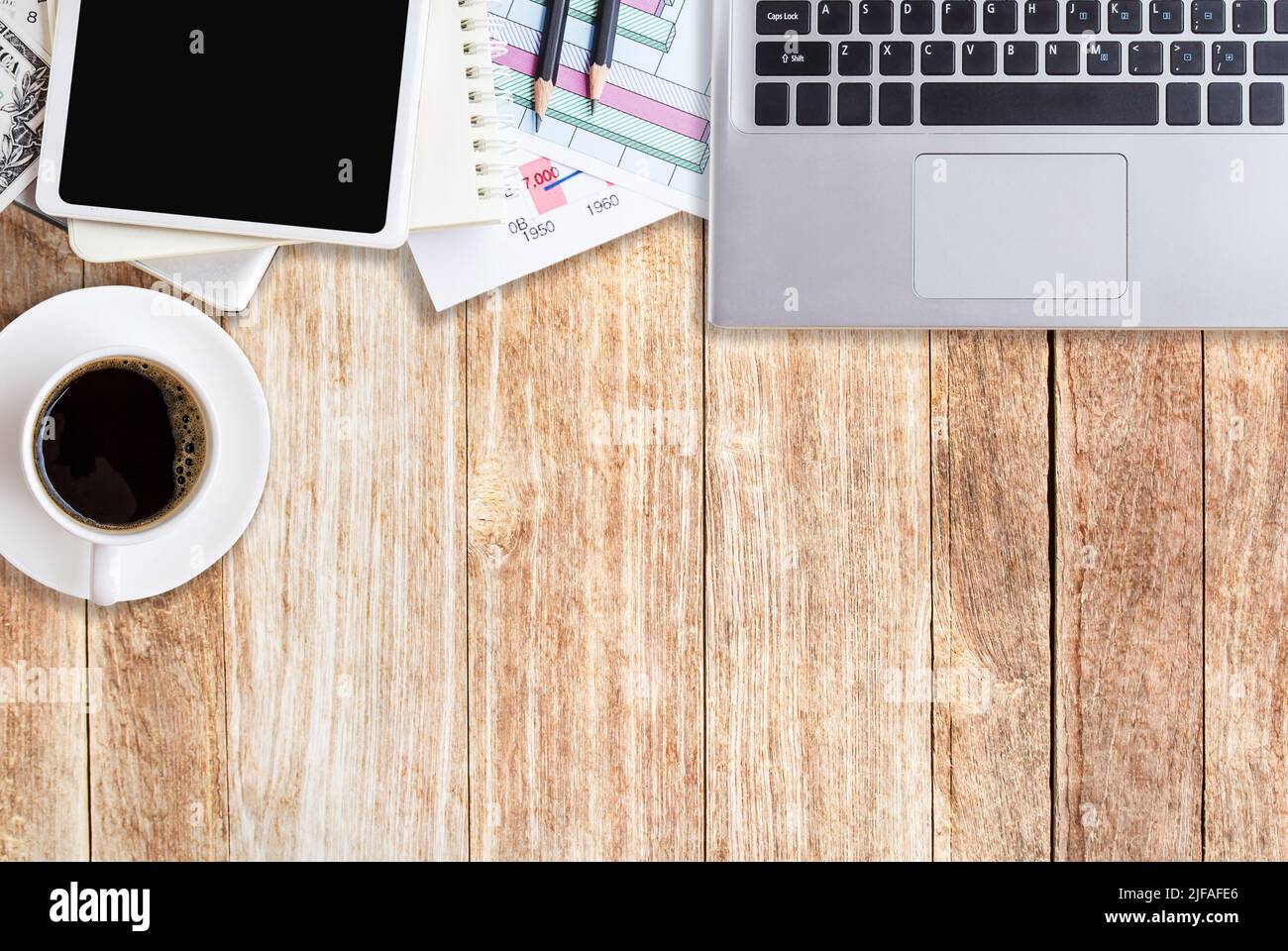 Office desk table with laptop computer, coffee cup and smart phone ...