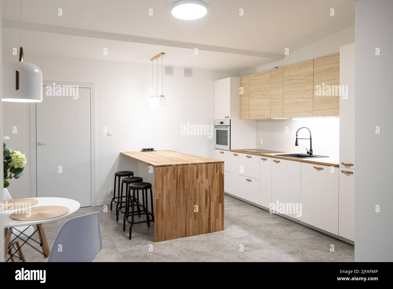 Modern apartment kitchen with a counte Stock Photo - Alamy