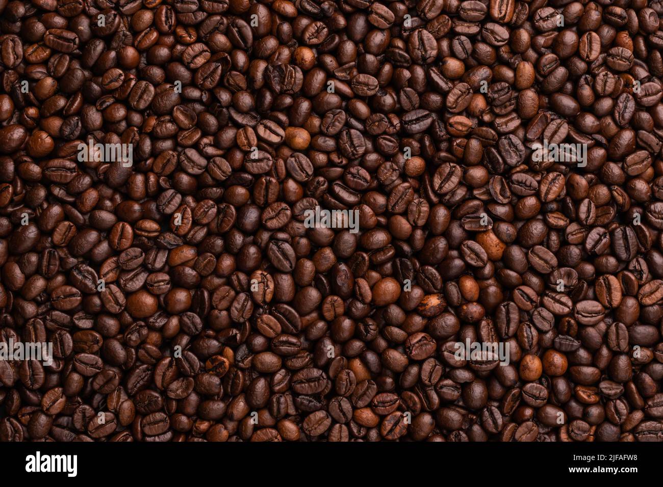 Roasted coffee beans. Top view brown coffee beans texture for backdrop ...