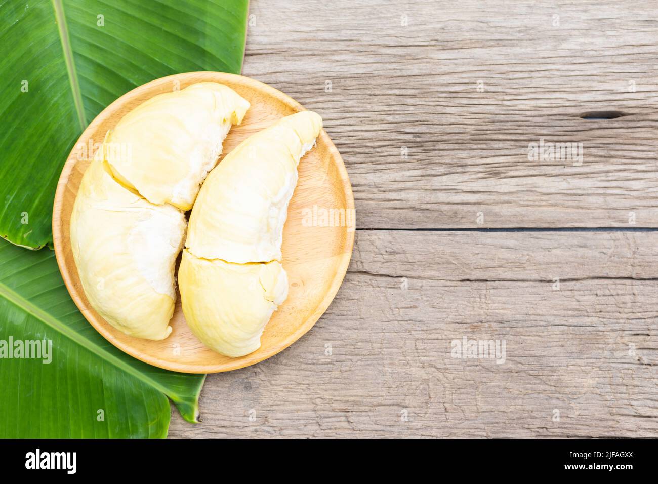Top view Durian fruit on wooden dish on wood table with copy space Stock Photo - Alamy