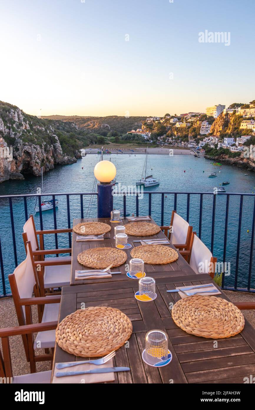 Menorca, Spain - Jun 30, 2022: People having dinner and coctails on one ...