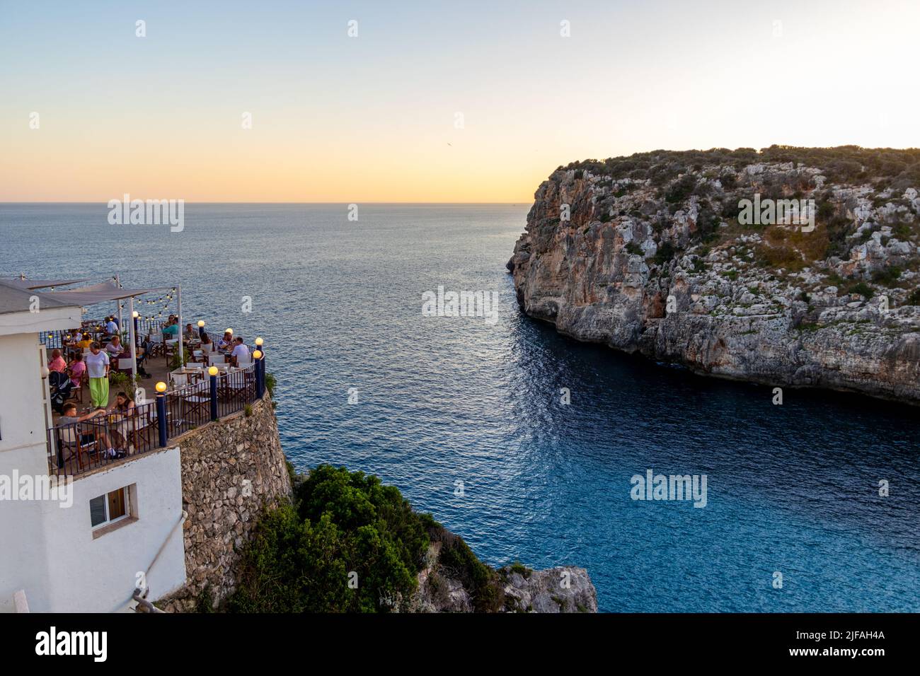 Menorca, Spain - Jun 30, 2022: People having dinner and coctails on one ...