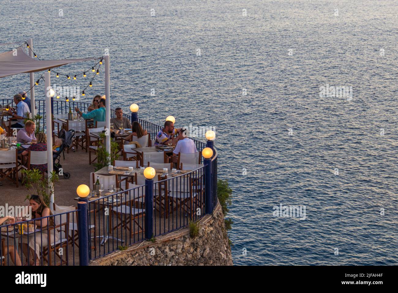 Menorca, Spain - Jun 30, 2022: People having dinner and coctails on one ...