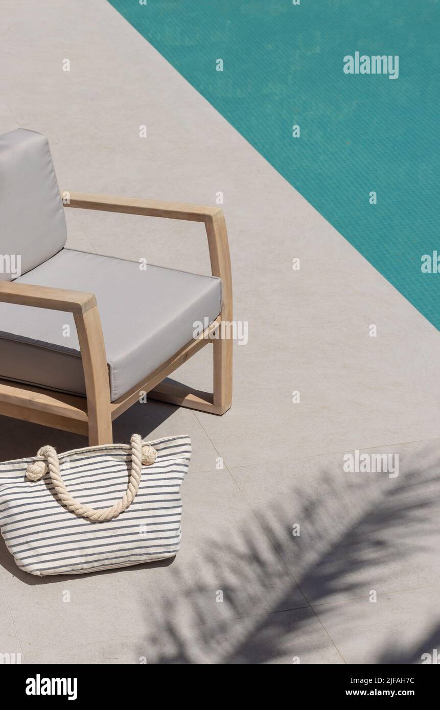 Swimming pool top angle view background of seating area and atriped ...