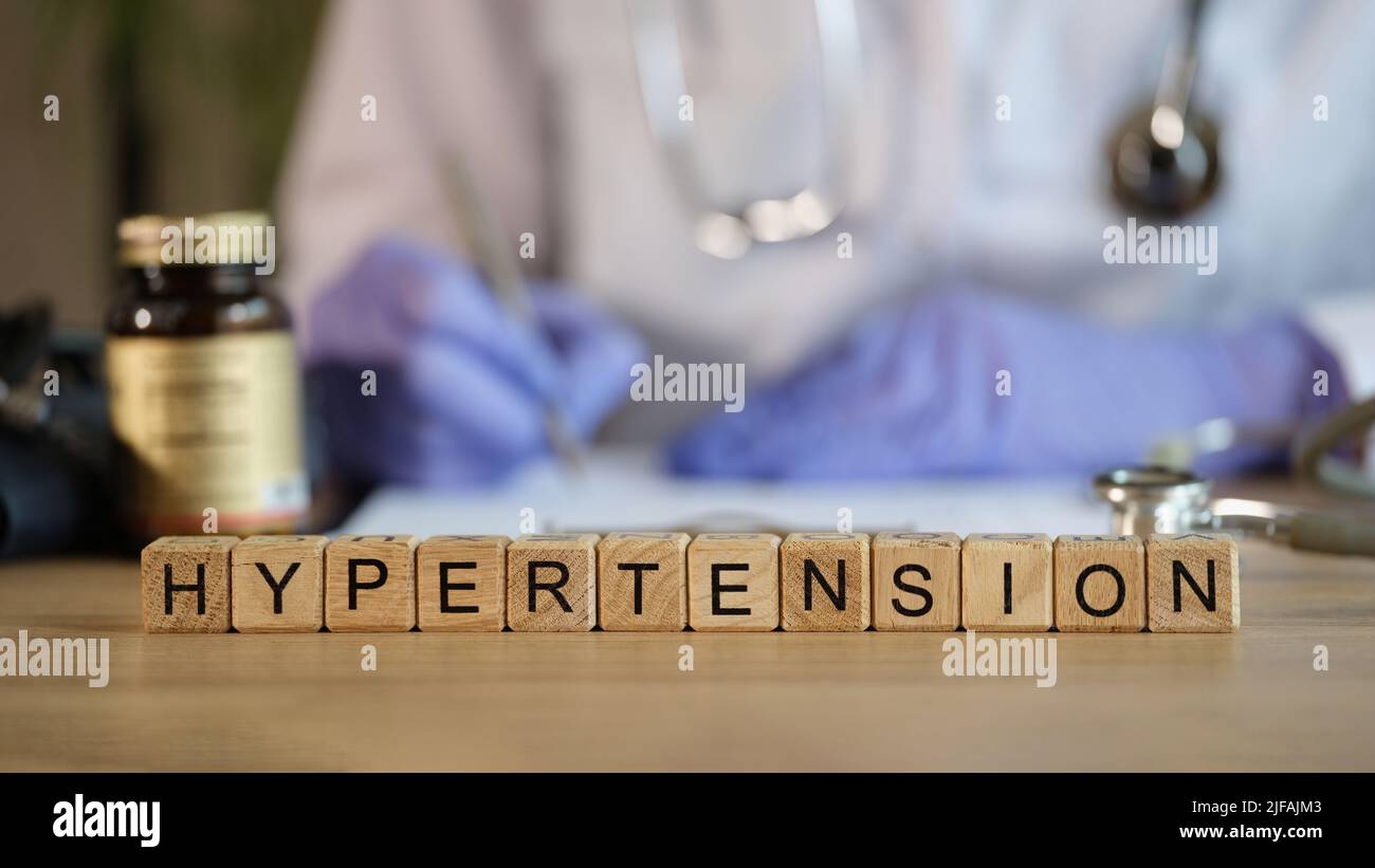 Hypertension word on cubes in cardiologist office in cardiology clinic ...