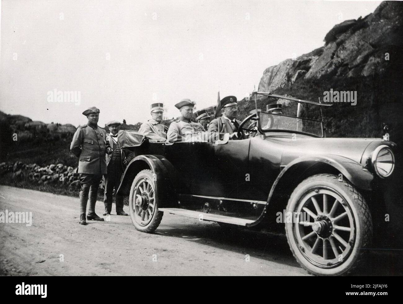 Soldiers travel in a civilian car of open model. Soldiers travel in a ...