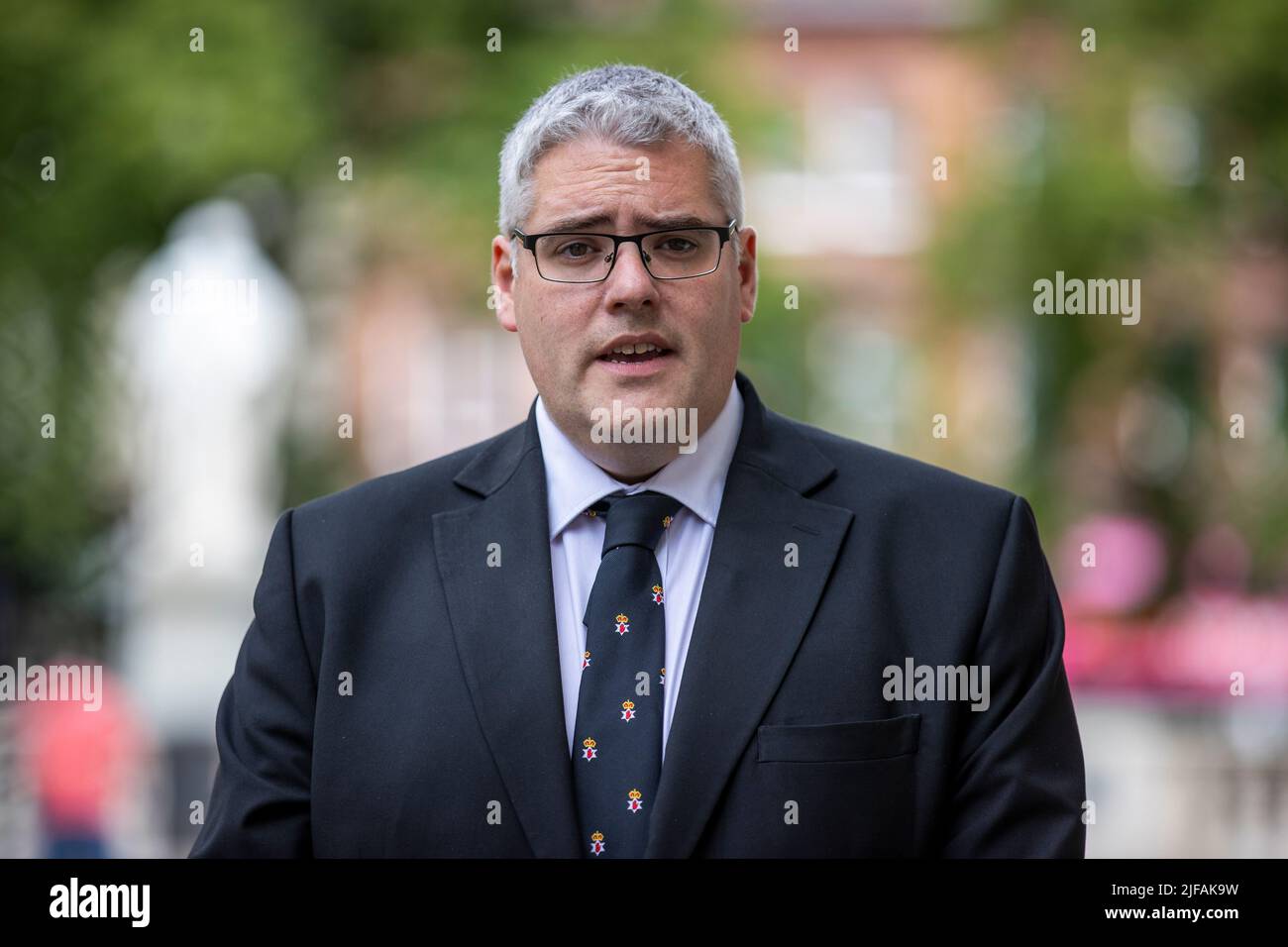 DUP MP Gavin Robinson speaking to the media after laying a wreath at ...