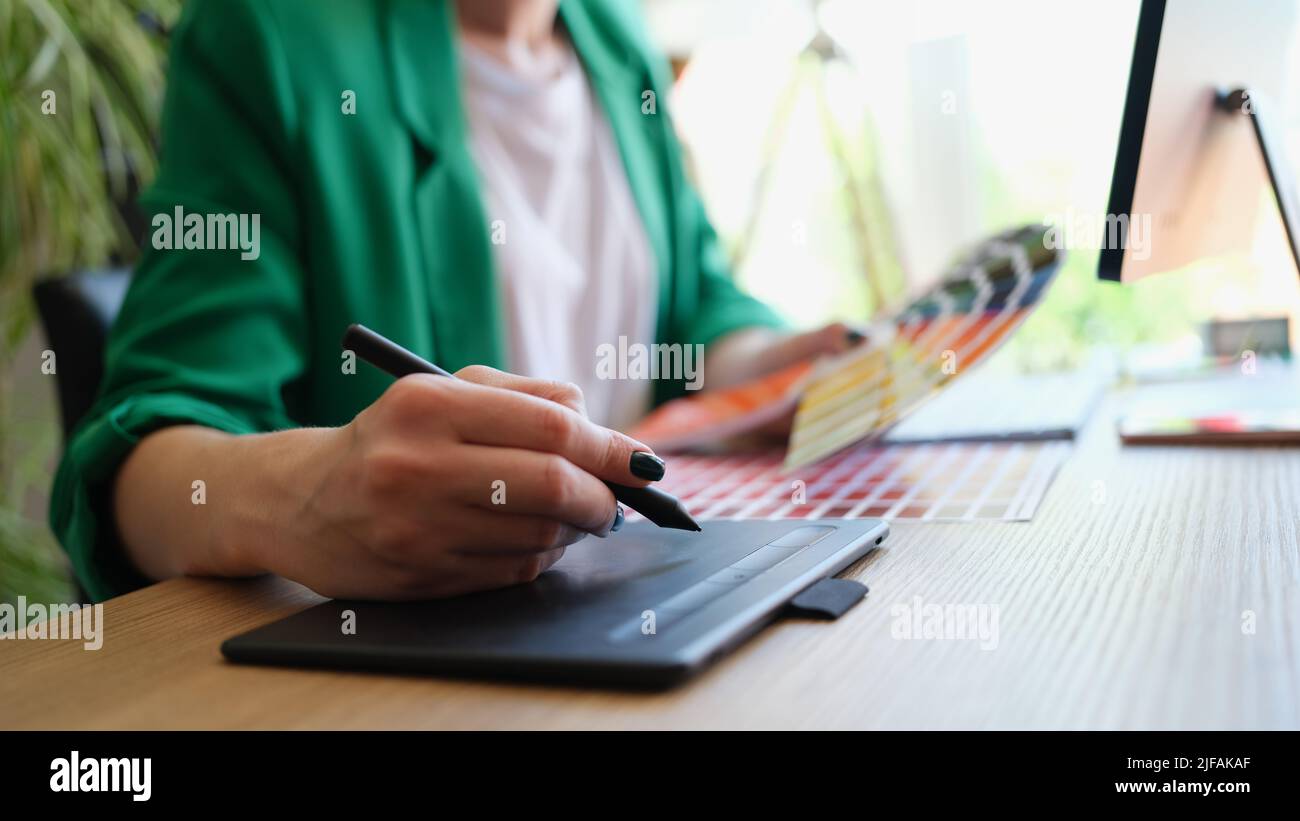 Professional female interior designer or graphic designer working on ...