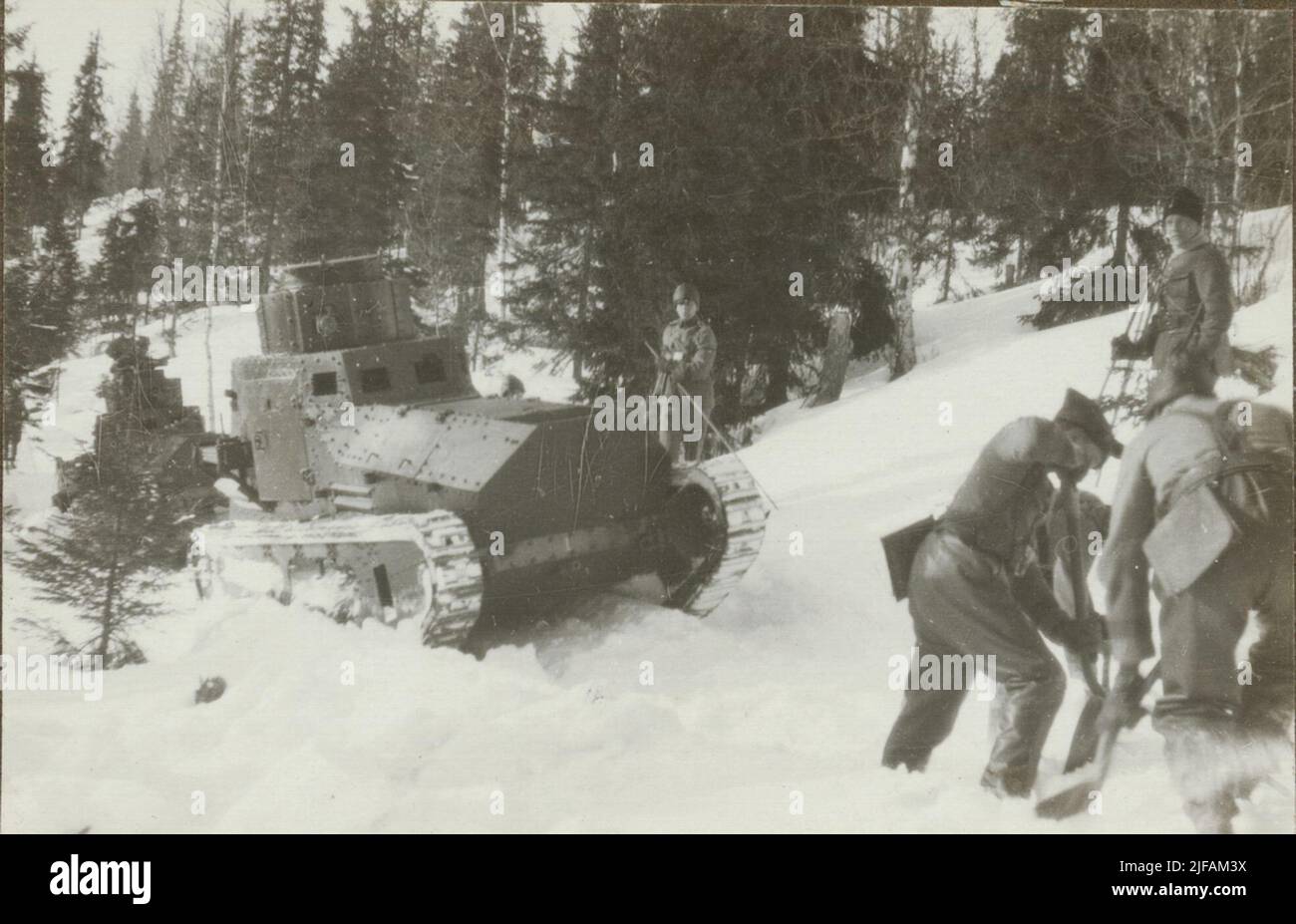 Two tanks m/1921 (or m/1921-1929) on the way up the hill. Soldiers ...