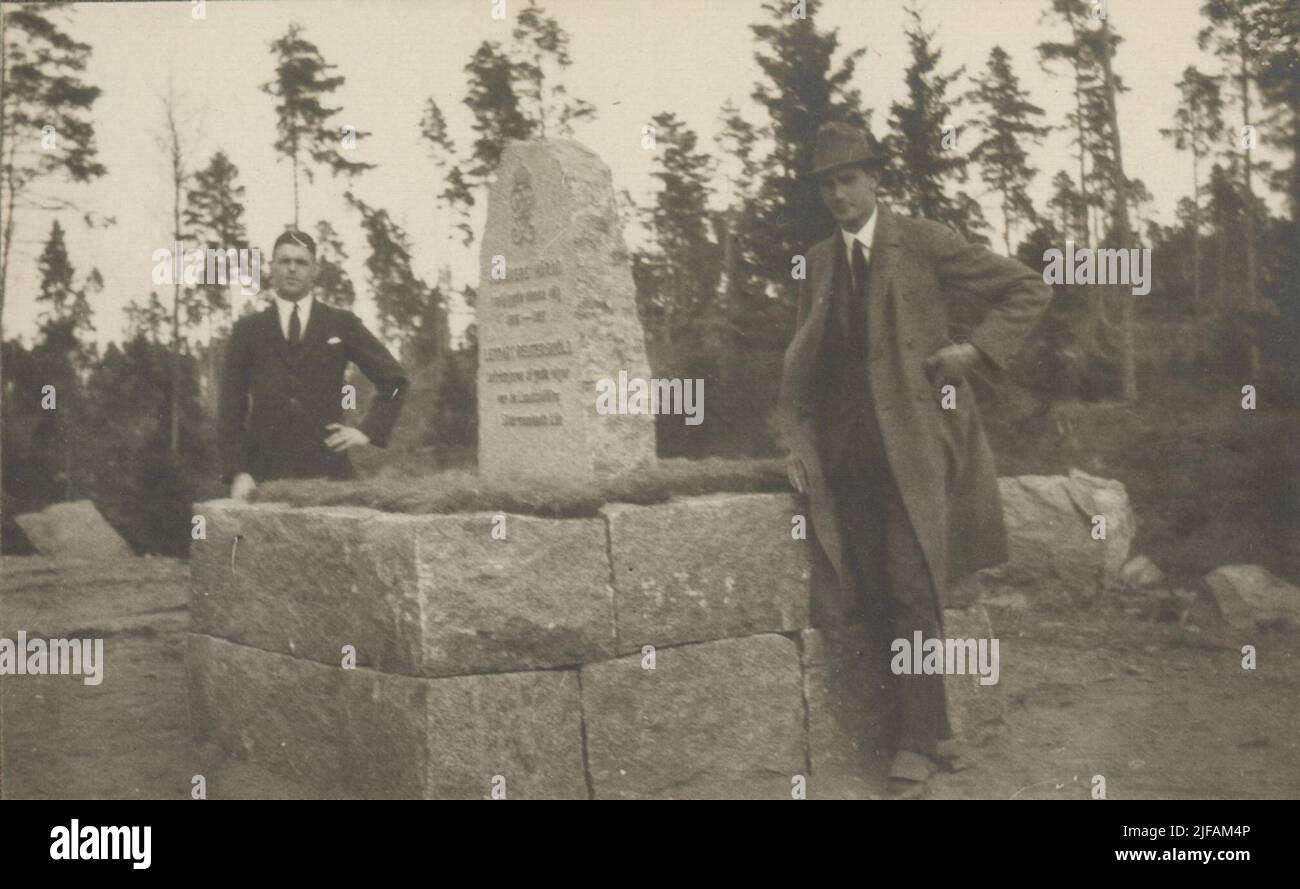 Two men at a stone monument Stock Photo - Alamy