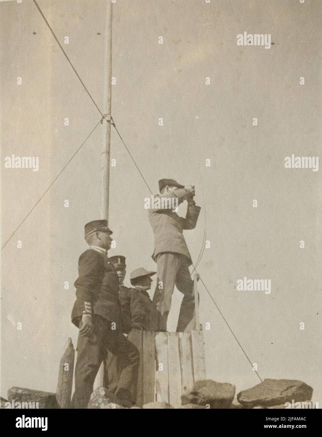 A watch on the mountain. Four soldiers at a mast keep an eye on the ...