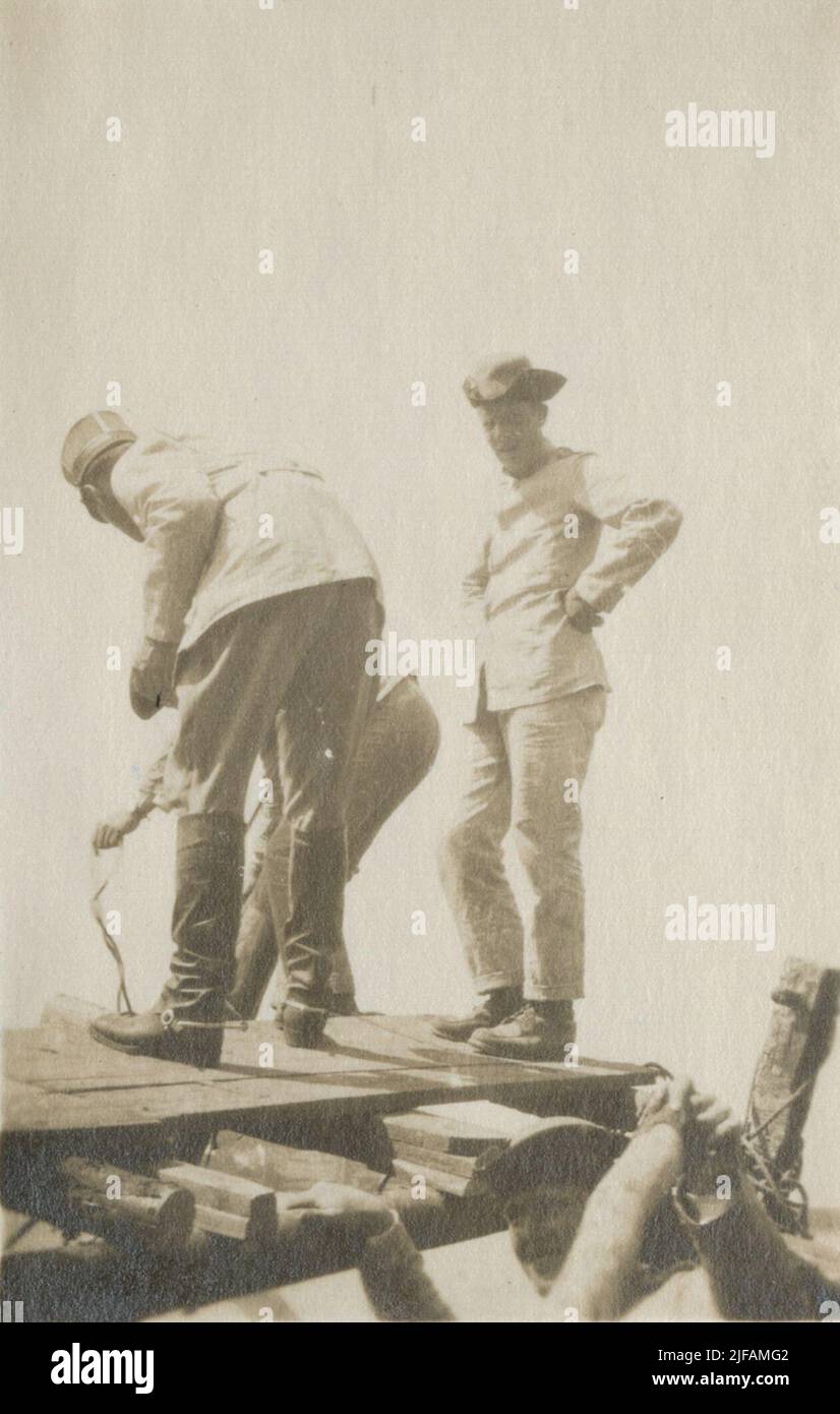 Three soldiers up on a scaffolding Stock Photo - Alamy