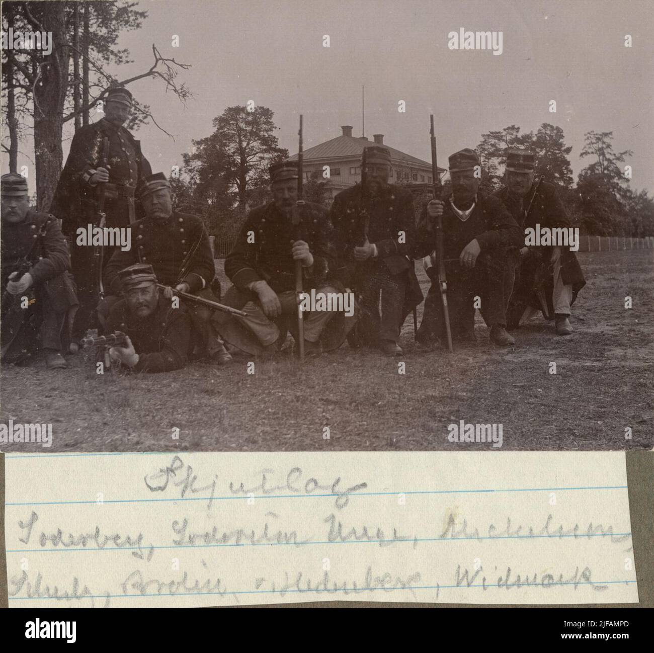 A group of soldiers at Hälsinge regiment with their rifles set up for ...