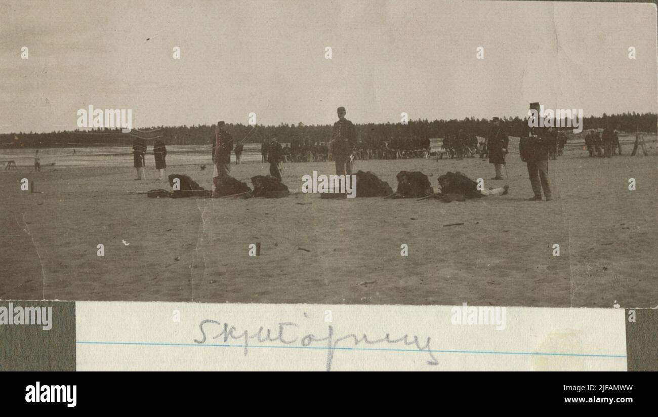 A group of soldiers over Skytte in landscape shooting position. Behind ...