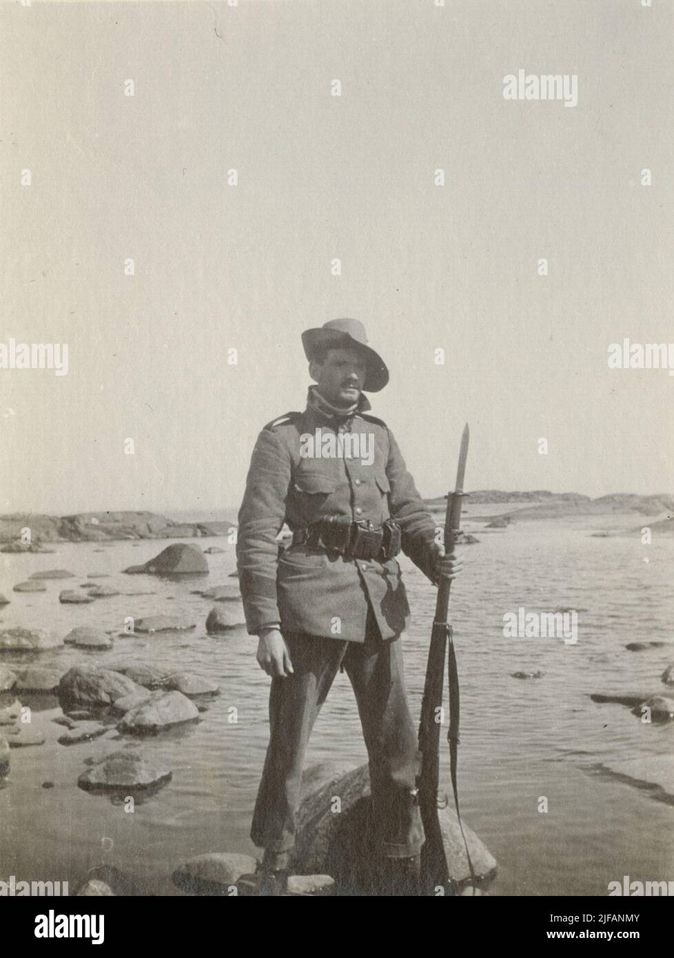 Portrait of soldier standing on the beach Stock Photo - Alamy