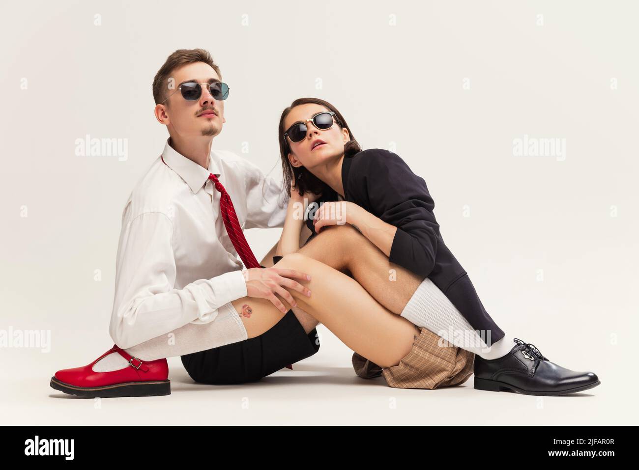 Full-length portrait of stylish young couple, man and woman in retro ...