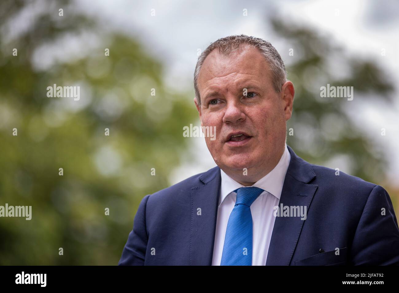 Minister of State for Northern Ireland Conor Burns speaks to the media ...