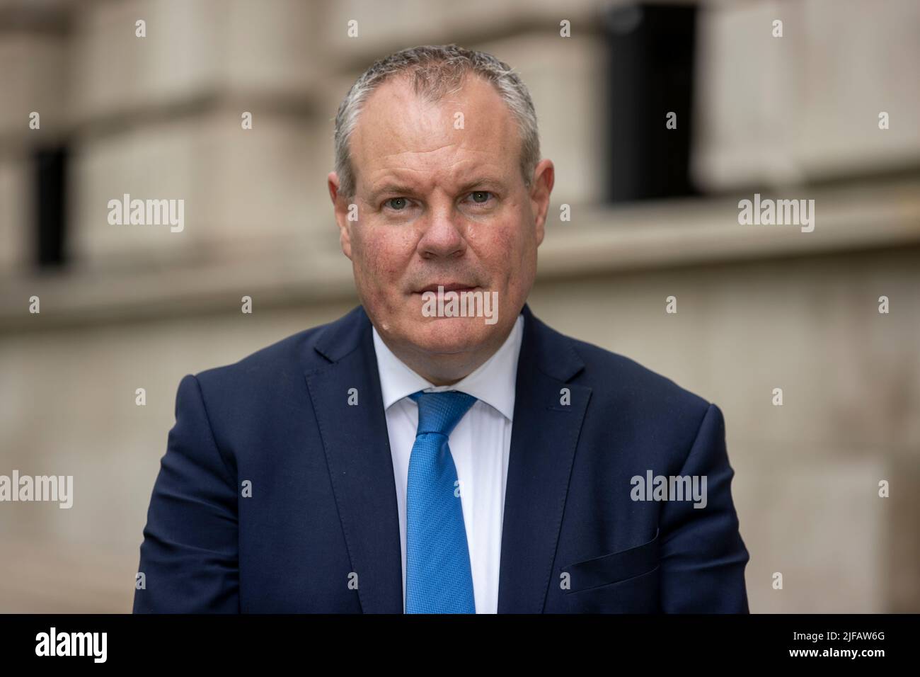Minister of State for Northern Ireland Conor Burns speaks to the media ...