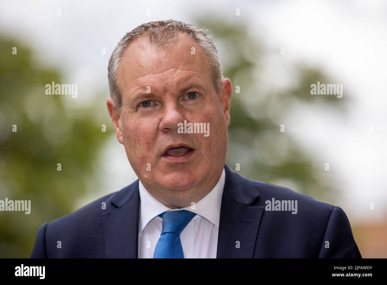 Minister of State for Northern Ireland Conor Burns speaks to the media ...