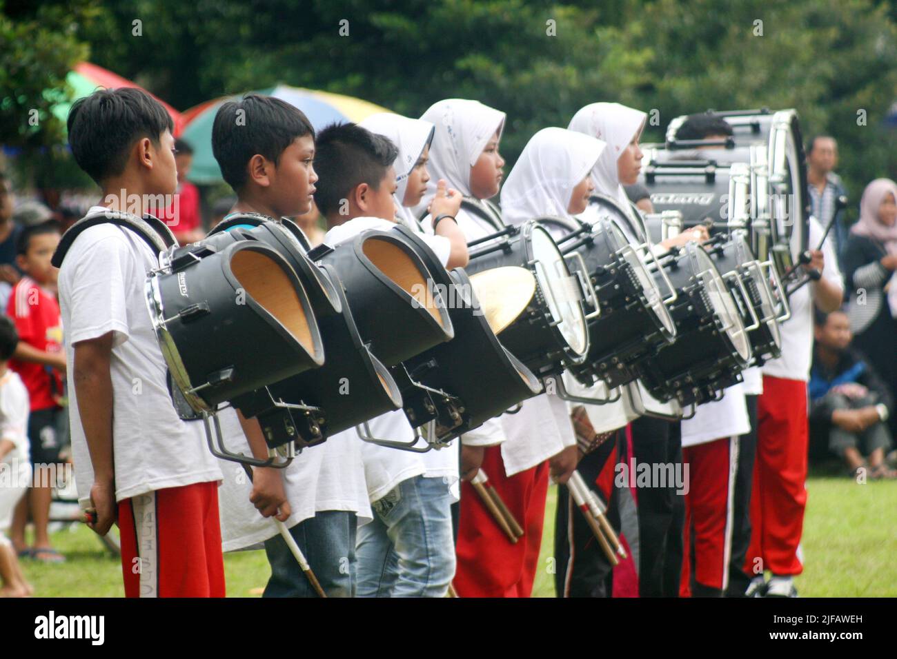 some students are practicing marching band with various musical ...