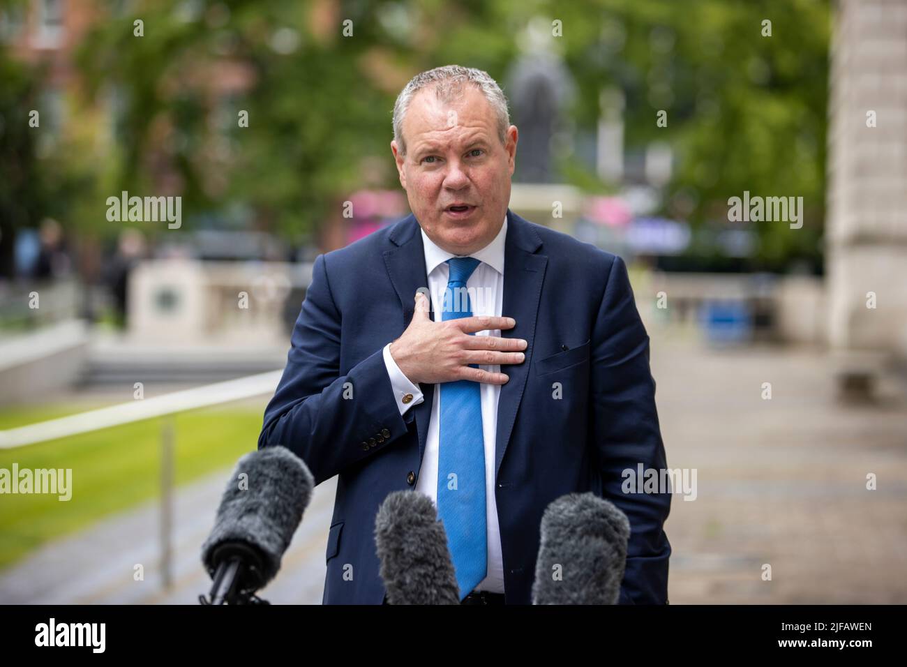 Minister of State for Northern Ireland Conor Burns speaks to the media ...